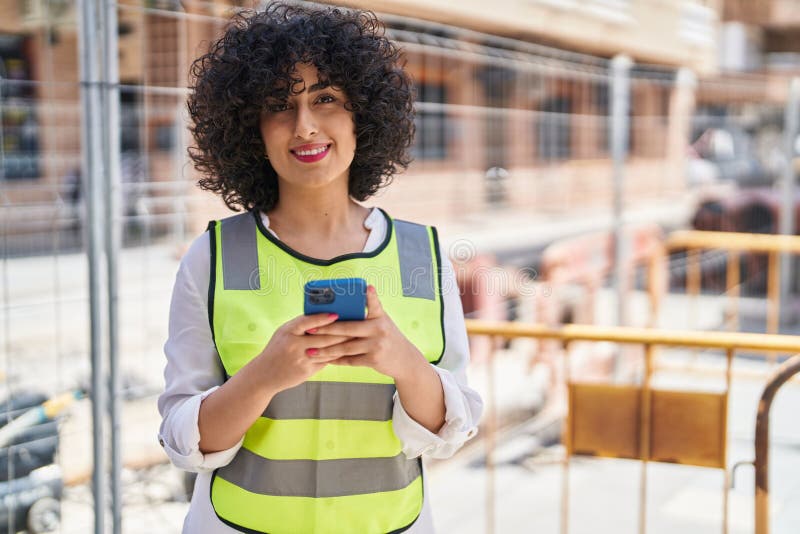 Young Middle East Woman Architect Using Smartphone at Street Stock ...