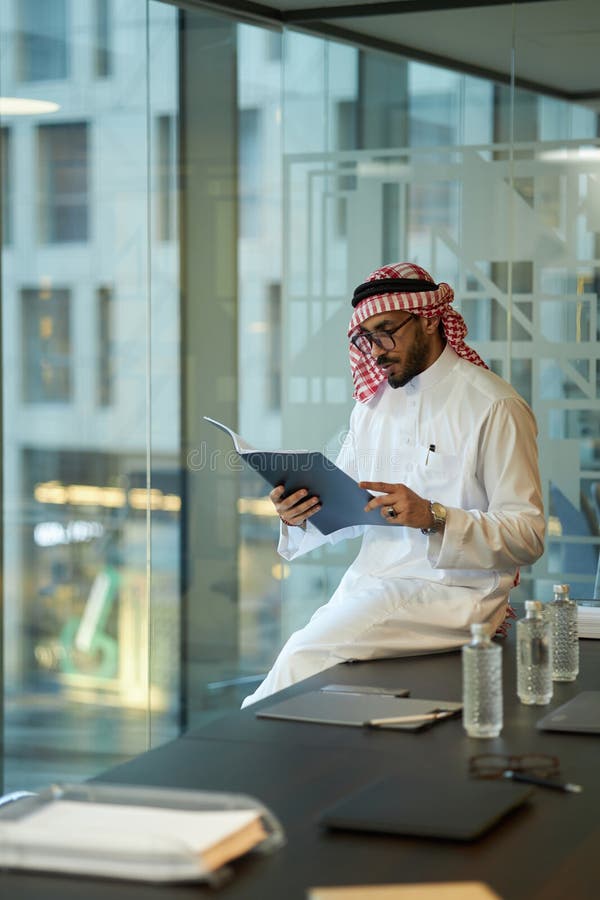 Young Middle Eastern Man Reading Agreement Stock Photos - Free ...