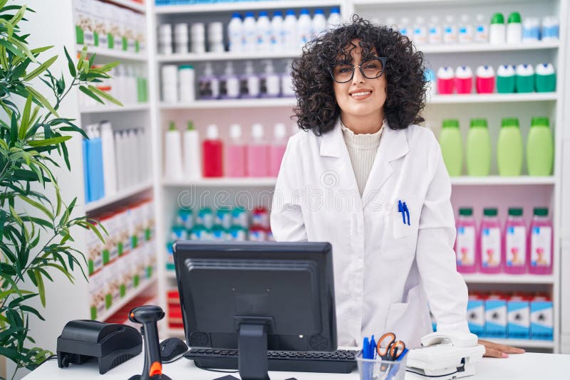 Young Middle Eastern Woman Pharmacist Smiling Confident Standing at ...