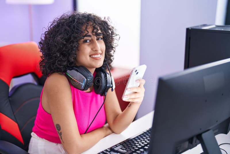 Young Middle Eastern Woman Streamer Using Computer and Smartphone at Gaming Room Stock Image ...
