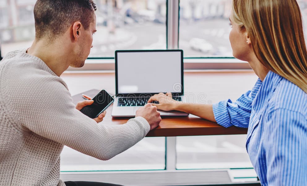 Two Students Searching Information on Website on Netbook Using Wireless ...