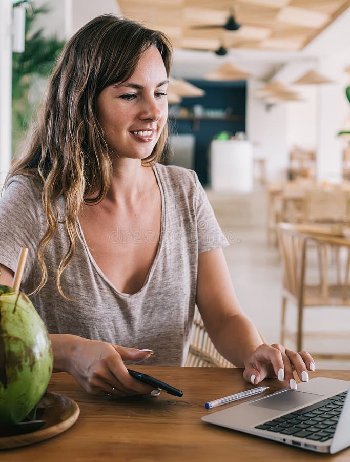 Young Millennial Woman Checking Setting on Laptop Device Sitting at ...