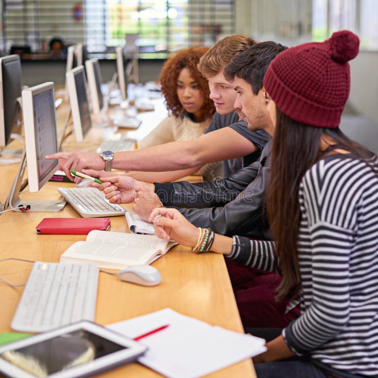Young Minds at Work. Students Working on Computers in a University Library. Stock Photo - Image ...