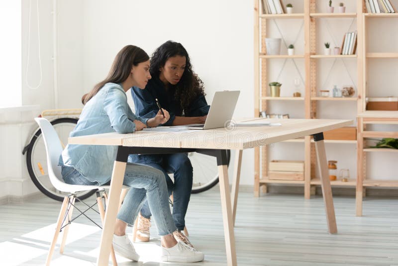 Young Mixed Race Coworkers Working on Startup Project. Stock Image ...