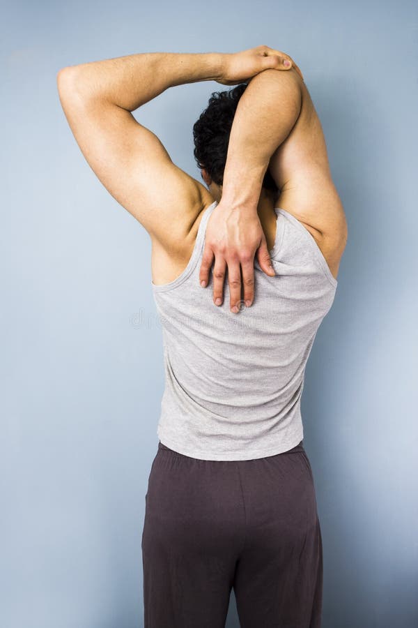 Young Mixed Race Man Stretching His Shoulder Stock Image - Image of ...