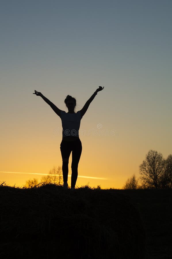 Girl Posing in a Field at Sunset Stock Photo - Image of posing, sunset ...
