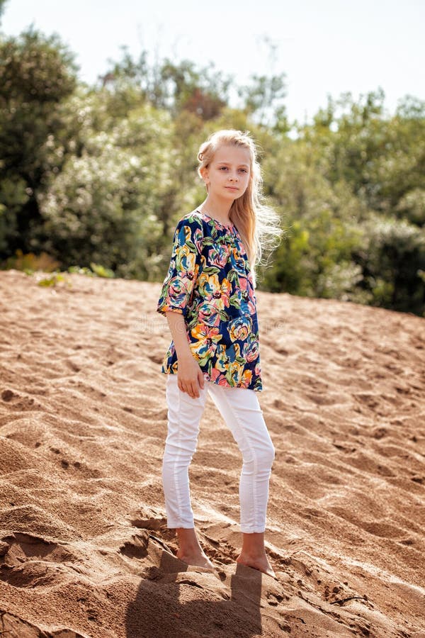 Young Model Posing in Casual Clothes on Beach Stock Photo - Image of ...