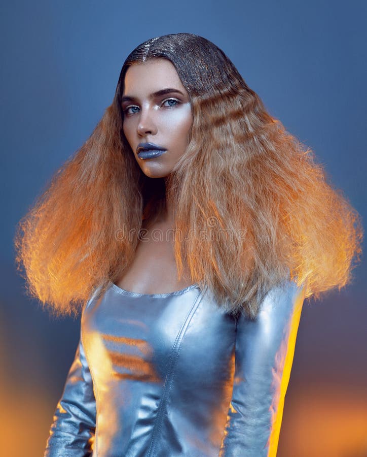 Young Model Posing in Studio in Silver Clothes Stock Photo - Image of ...