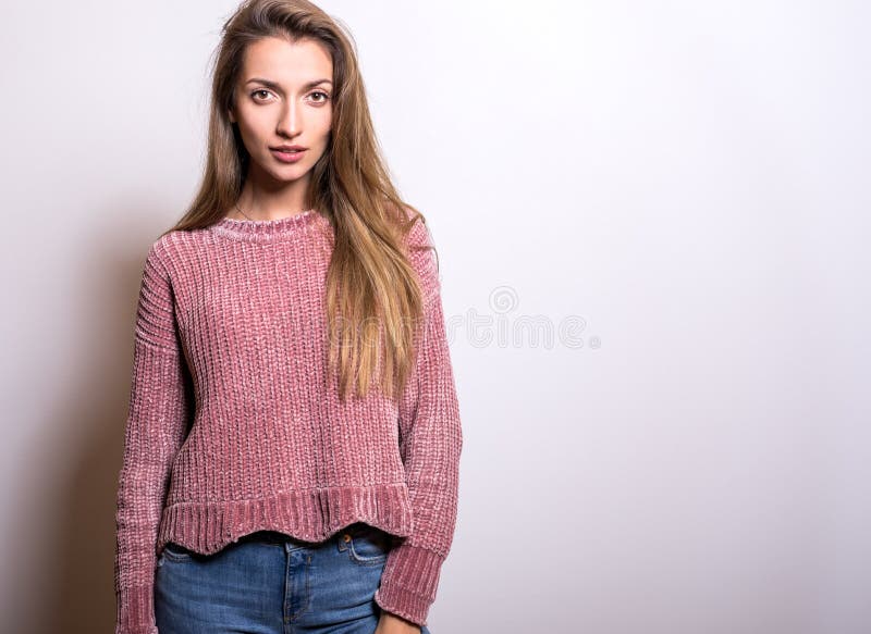 Young Model Woman in Sweater Pose in Studio. Stock Photo - Image of ...