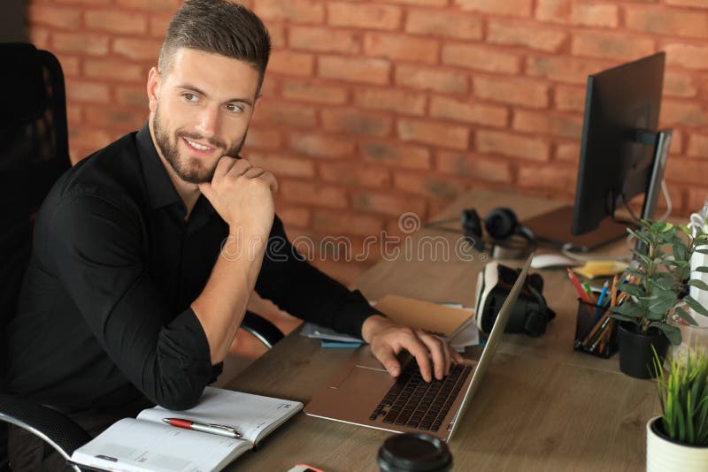 Young Modern Business Man Analyzing Data Using Laptop while Working in ...