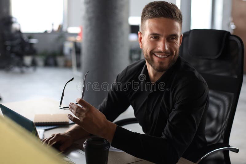 Young Modern Business Man Analyzing Data Using Laptop while Working in ...
