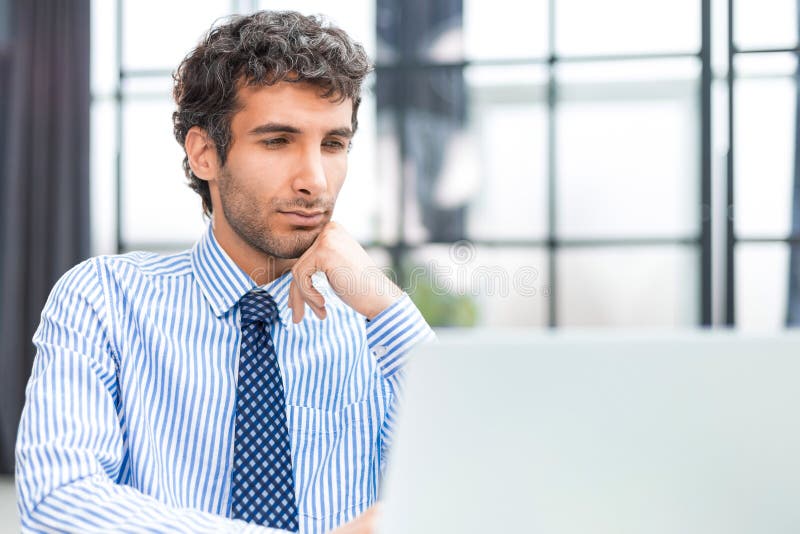 Young Modern Business Man Working Using Computer while Sitting in the ...