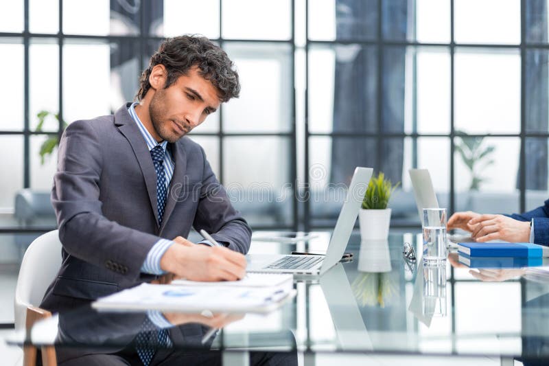 Young Modern Business Man Working Using Computer while Sitting in the ...