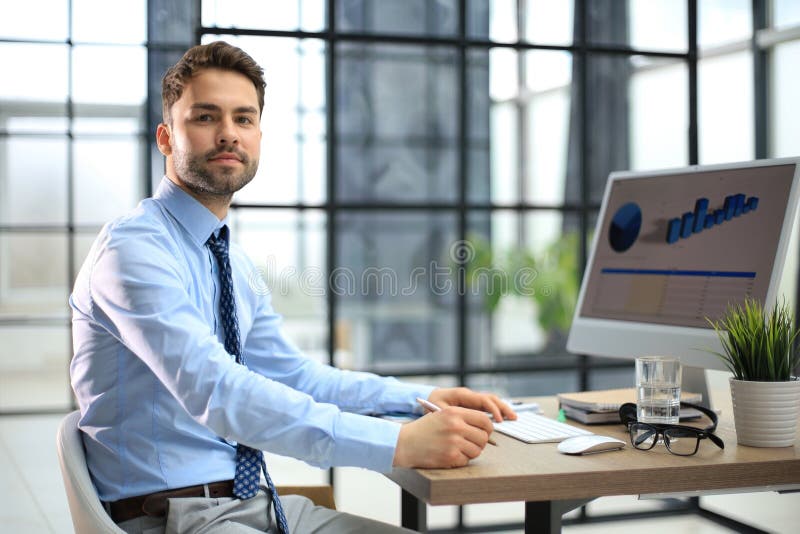 Young Modern Business Man Working Using Computer while Sitting in the ...