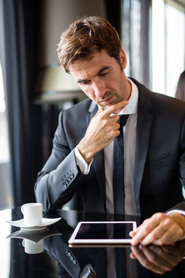 Young Modern Business Man Working Using Digital Tablet while Sitting in ...