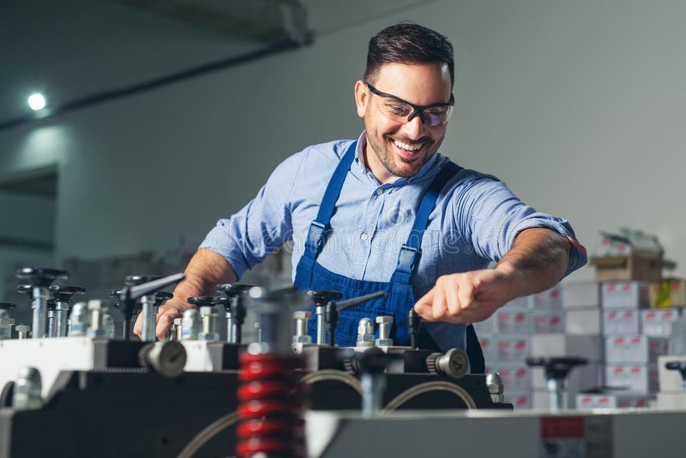 Modern Industrial Machine Operator Working in Factory. Worker on the ...