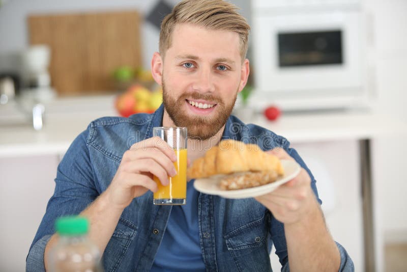 Young Modern Man Eating Sandwiches at Home Stock Photo - Image of ...