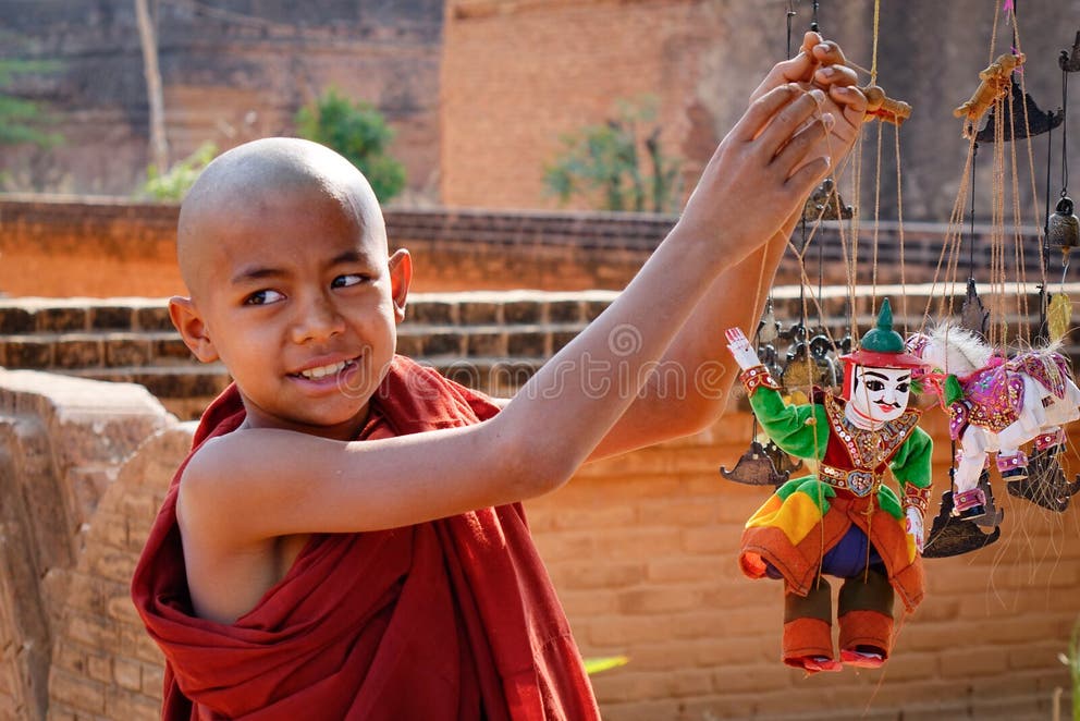 A Young Monk Playing with Puppets in Bagan, Myanmar Editorial Stock ...