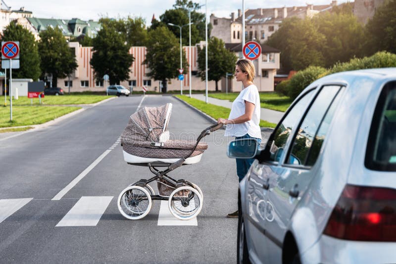 Young Mother with the Baby Pram is Walking by the Crosswalk Stock Image ...