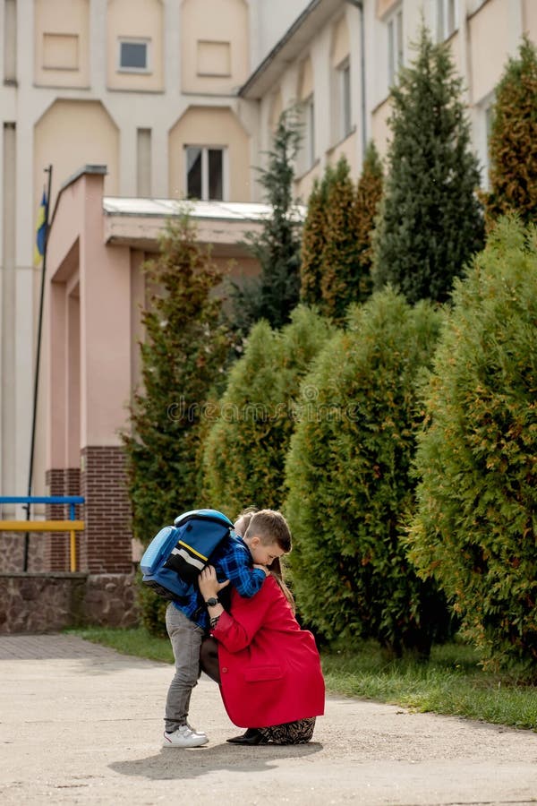 Young Mother Embraces Her Excited First Class Son on the Way To School ...