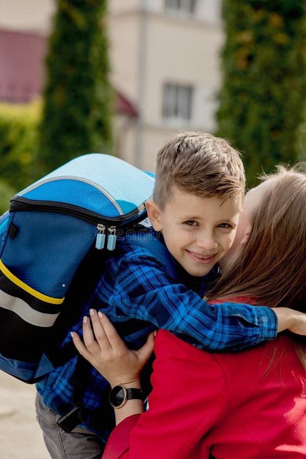 Young Mother Embraces Her Excited First Class Son on the Way To School ...