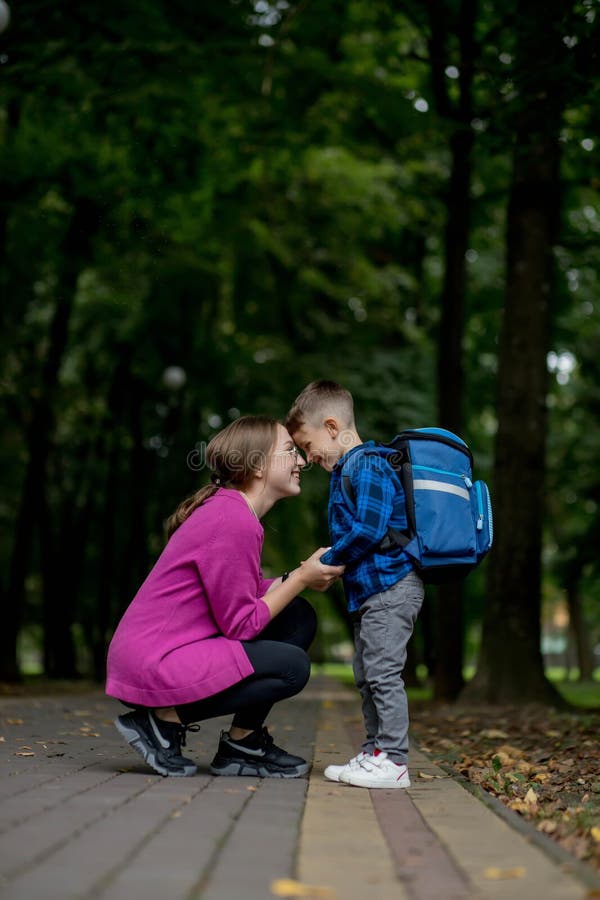 Young Mother Embraces Her Excited First Class Son on the Way To School ...