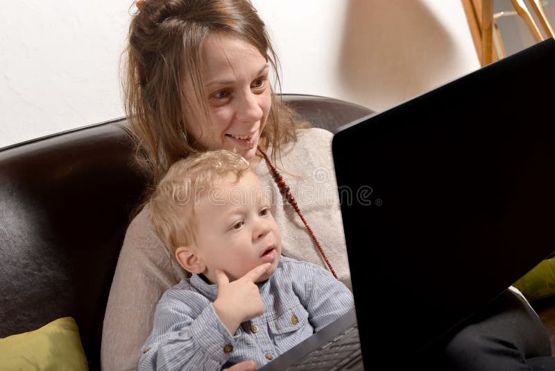 Young Mother and Her Child Looking at a Computer Stock Photo - Image of ...