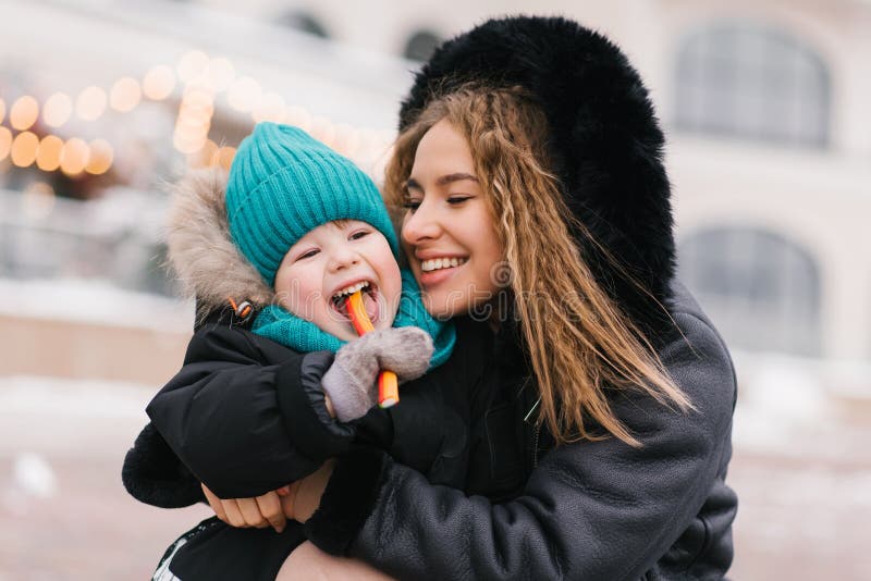 Young Mother is Holding Boy and they are Both Smiling. the Child is ...