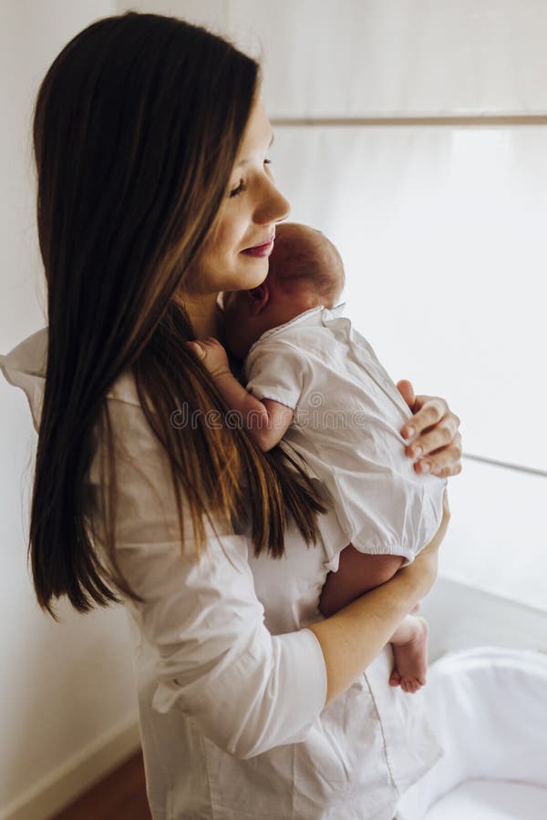 Young Mother Holding Newborn Baby Stock Photo - Image of cute, health ...