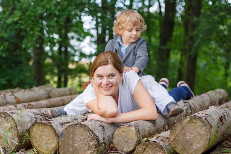 Young Mother and Little Son Having Fun in Summer Forest. Stock Photo ...