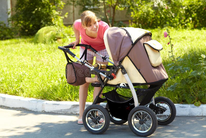 Mother and Baby in Stroller Stock Photo - Image of months, happy: 21627000