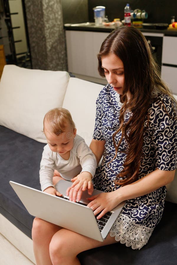 Working mom with baby stock image. Image of busy, family - 6914637
