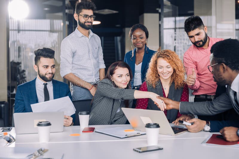Creative Multiracial Design Professionals Planning Strategy at Table in ...