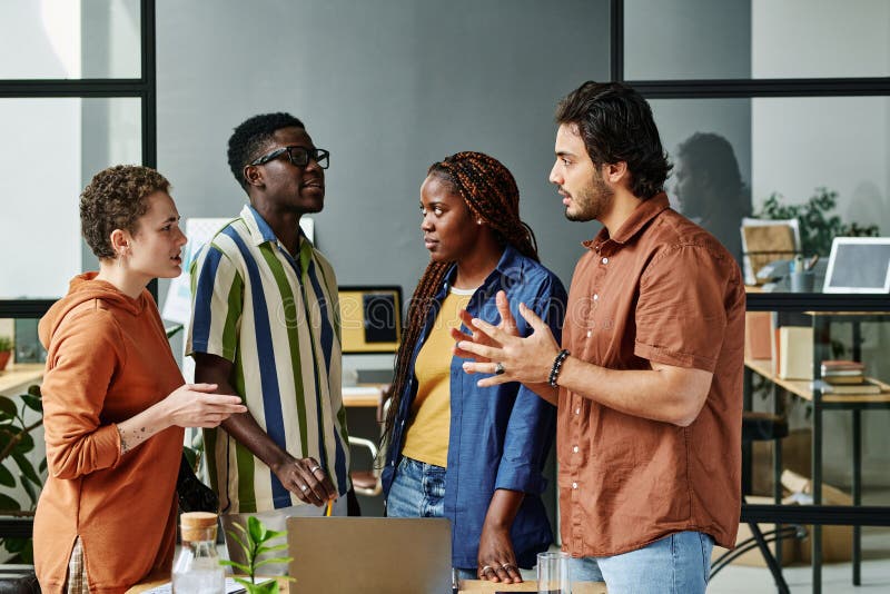 Young Multicultural Designers Having Discussion of Ideas Stock Photo ...