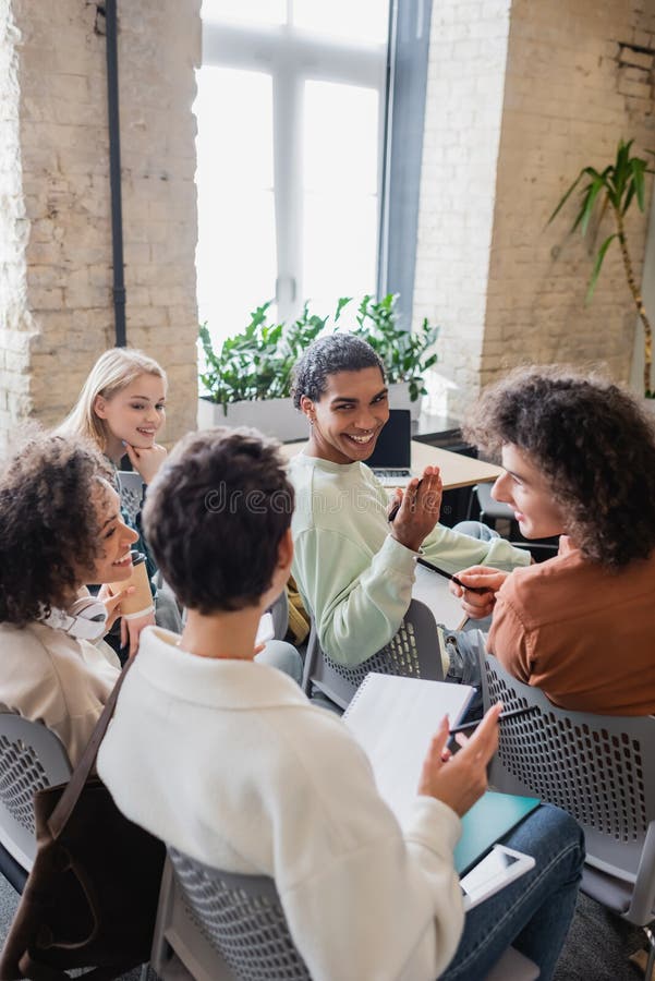 Young Multicultural Students Sitting in Classroom Stock Photo - Image ...