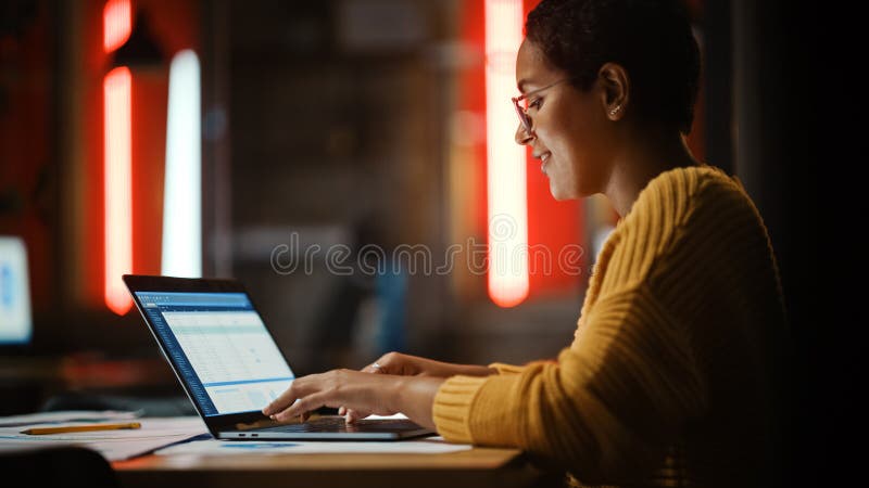 Young Multiethnic Developer Working on a Laptop Computer in Creative ...