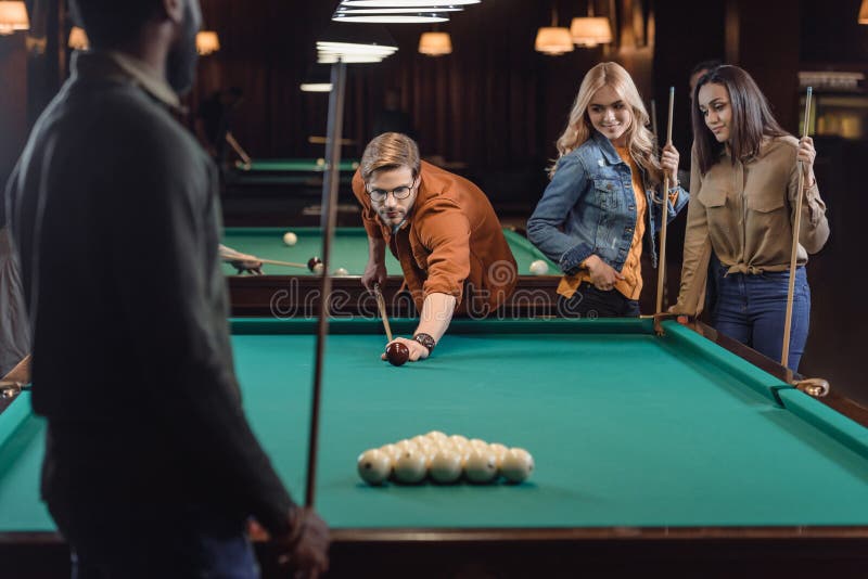 Young Multiethnic Friends Playing in Pool Stock Image - Image of ...