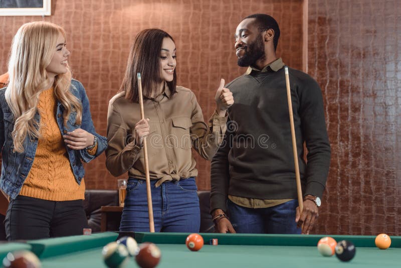 Young Multiethnic Friends Playing in Pool Stock Photo - Image of ...
