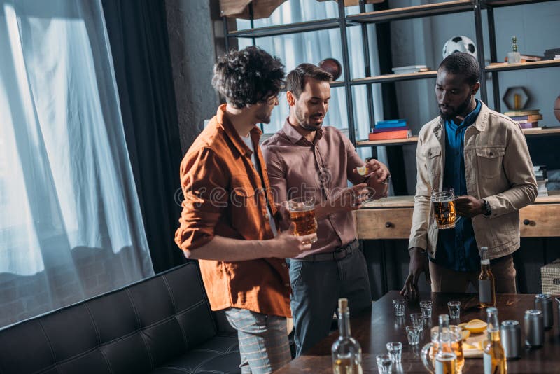 Young Multiethnic Men Drinking Beer Stock Image - Image of cans ...