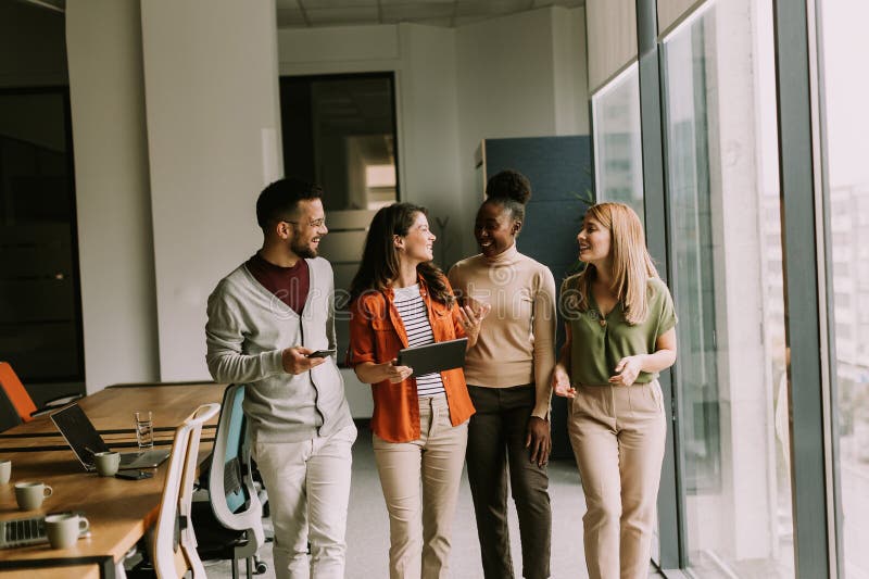 Young Multiethnic Startup Team Walking in the Modern Office Stock Image ...