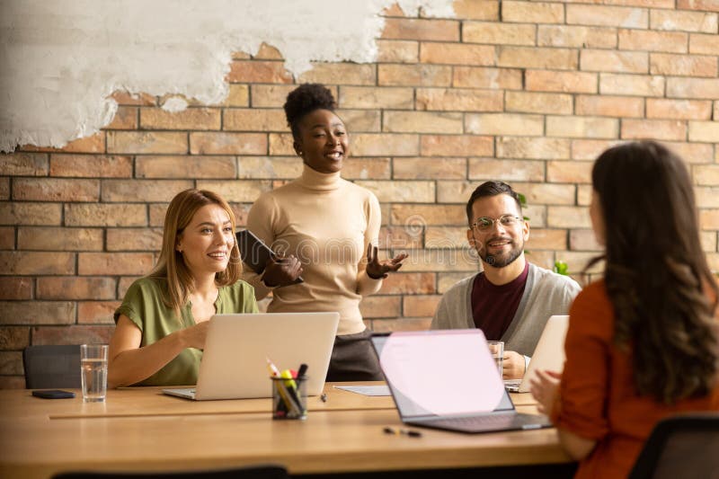 Young Multiethnic Startup Team Working in the Rustic Office Stock Photo ...