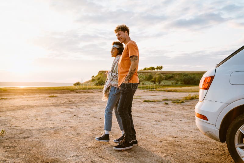 Young Couple Smiling and Hugging during Car Trip Stock Photo - Image of ...