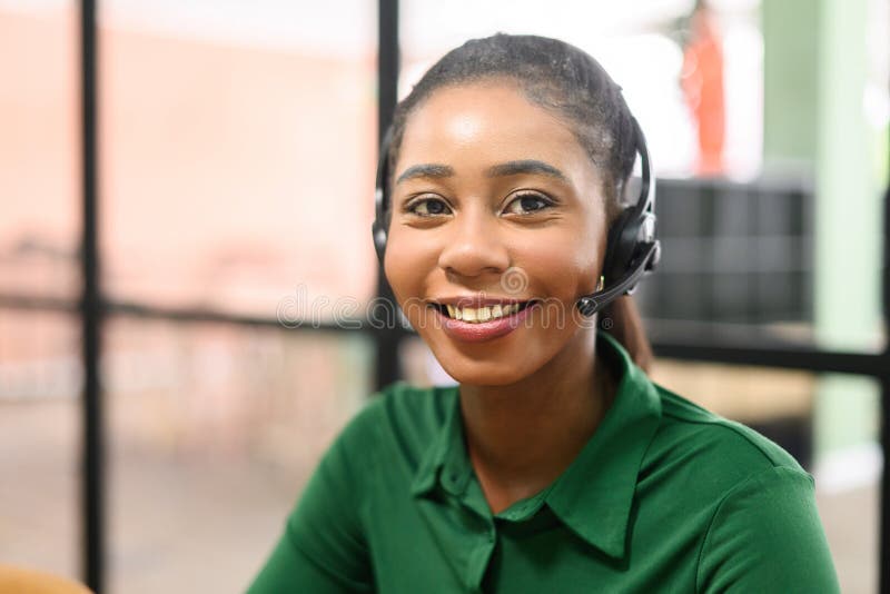 Young Multiracial Female Call Center Operator with Hands-free Headset ...