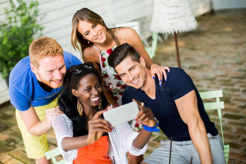 Young Multiracial Friends at Cafe Stock Photo - Image of adults ...