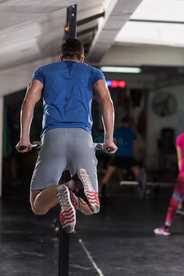Man Doing Exercises Parallel Bars Stock Image - Image of athletic ...
