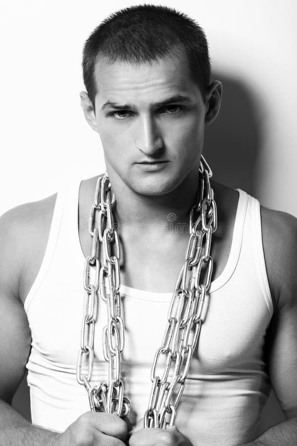 Young Muscular Man with Chains on His Shoulders Stock Photo - Image of ...
