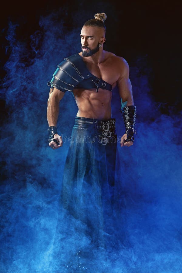 Young and Muscular Man Performing a Theatrical Pose on Stage. Stock ...