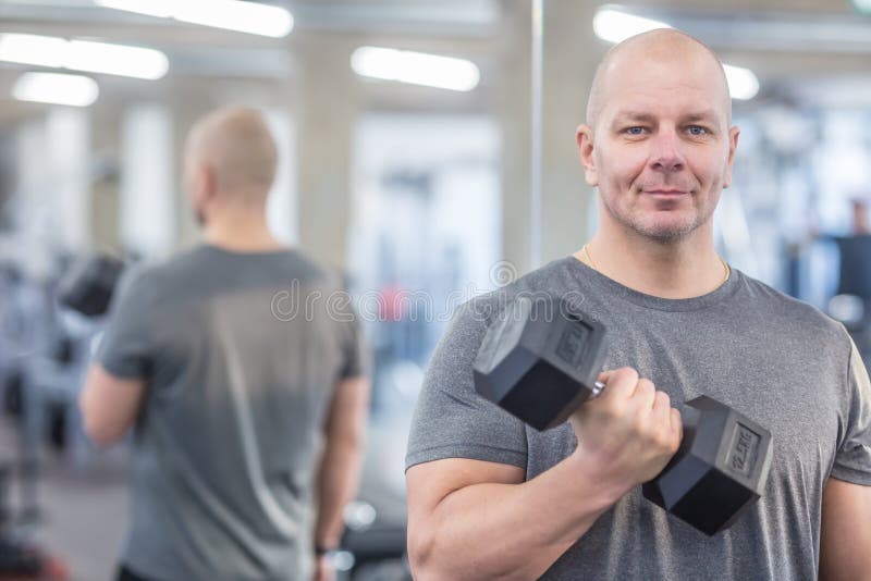 Young Muscular Man or Trainer Exercising in Gym Stock Image - Image of ...