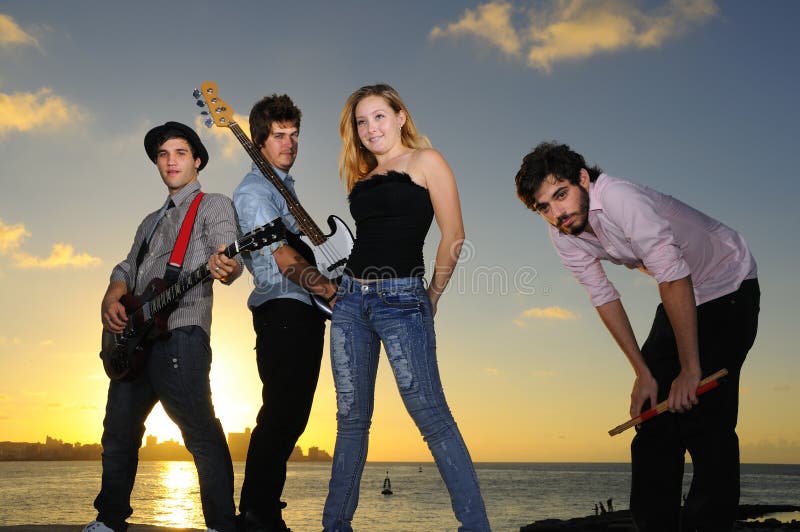 Young Musical Band Posing Outdoors with Attitude Stock Image - Image of ...