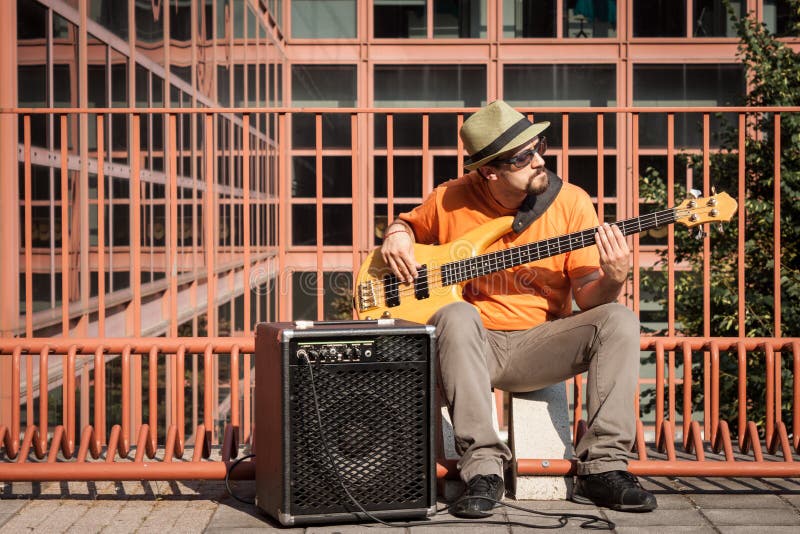 Young Musician Playing Bass Guitar Stock Image - Image of street, urban ...